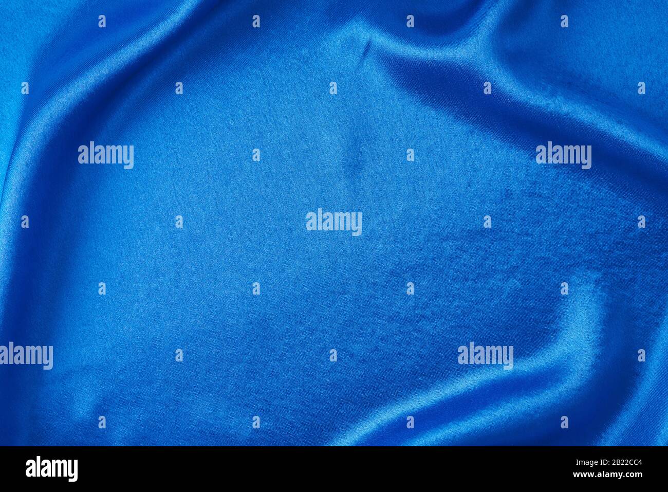 Blue silk background with folds. Abstract texture of rippled satin ...