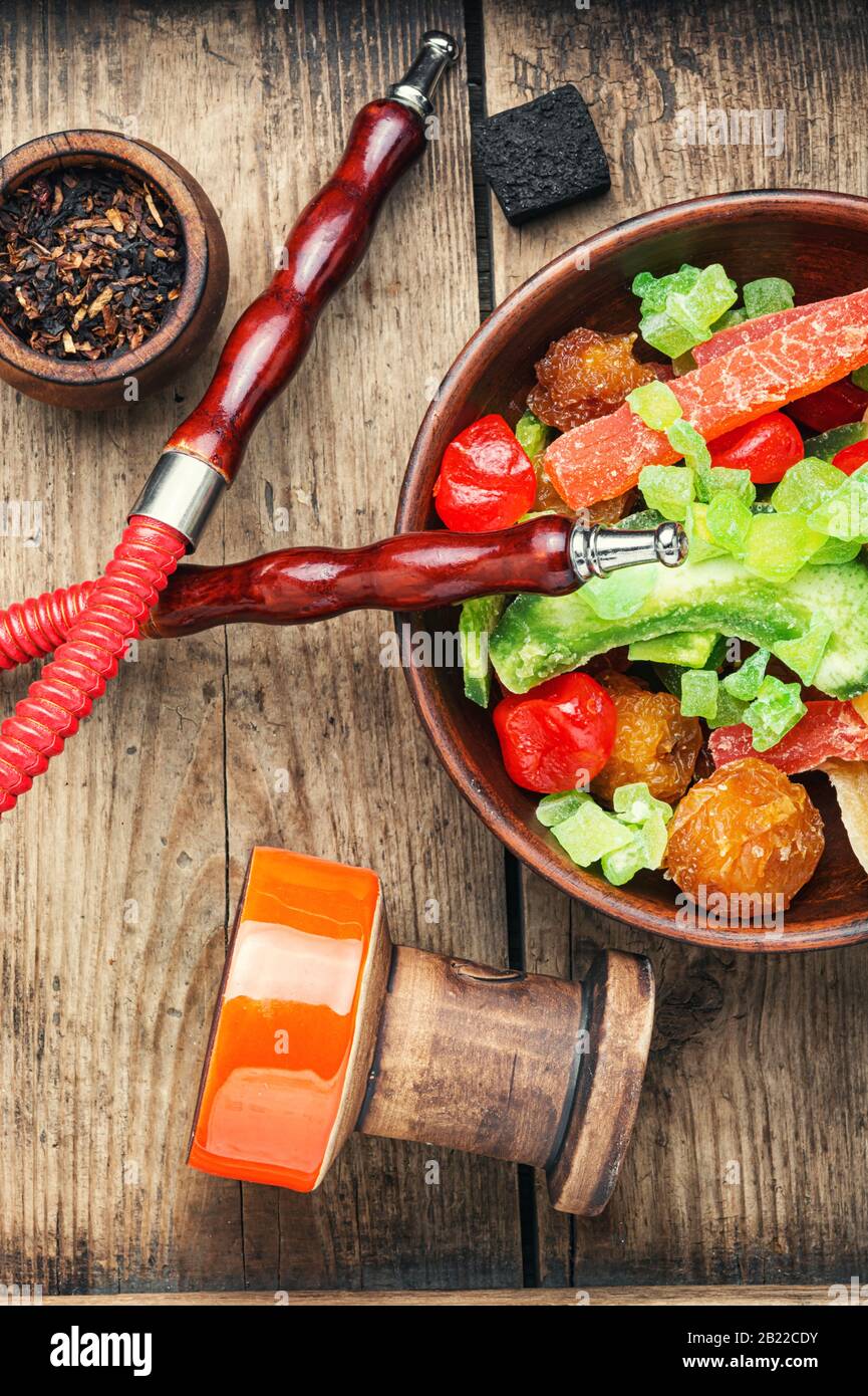 Details of oriental hookah and shisha tobacco with candied fruit ...