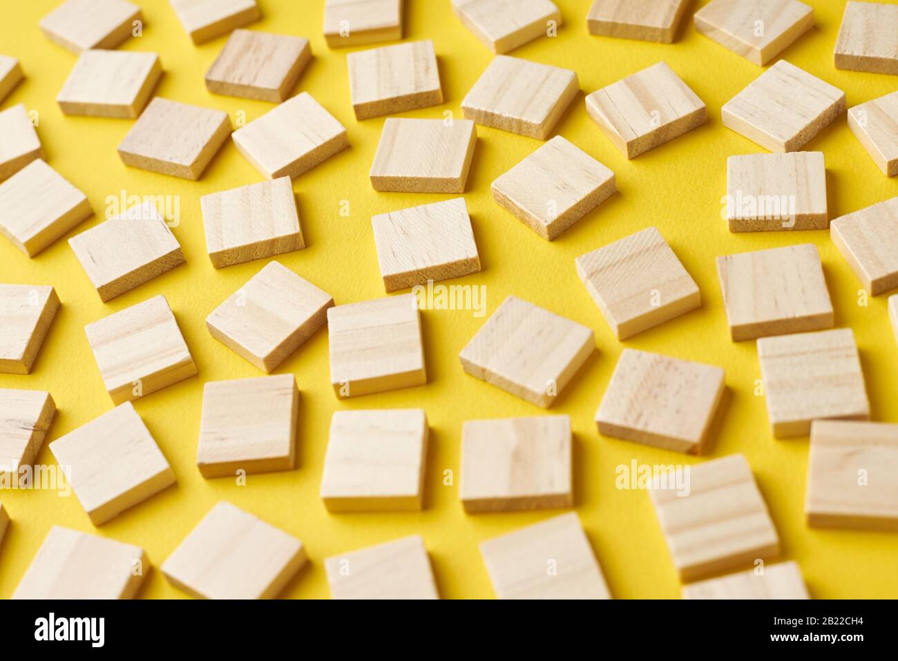 Empty wooden blocks pattern on yellow background, top view Stock Photo ...