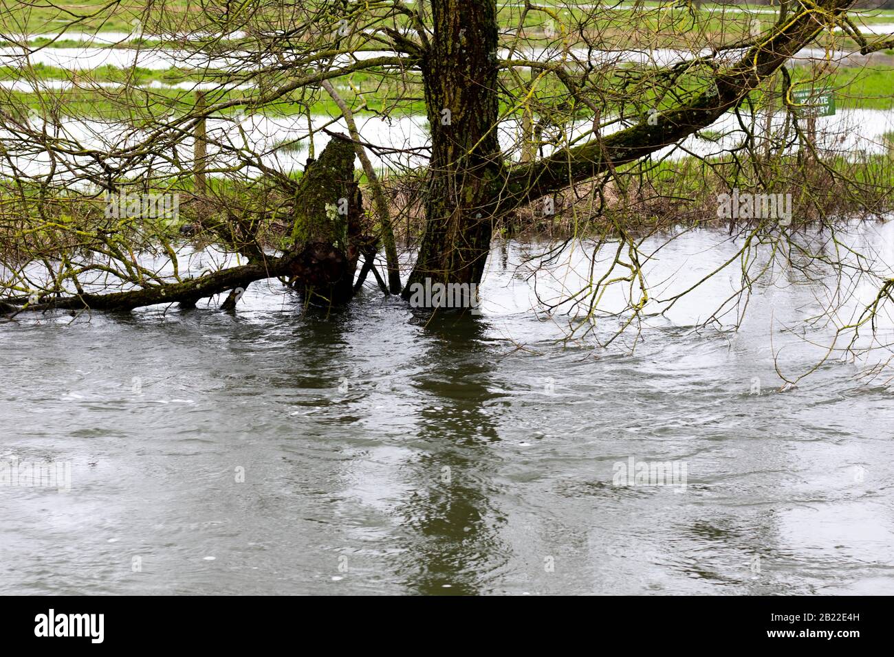 Flooded river after heavy storm rainfall flooding adjacent farmland ...