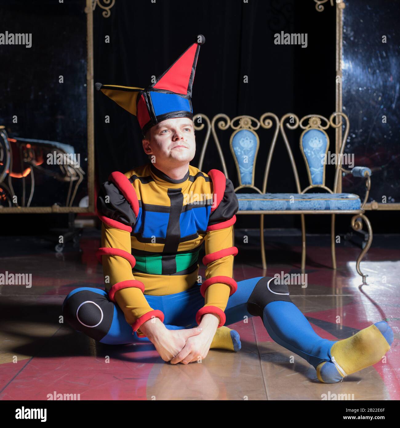 Actor dressed jester's costume in interior of old theater Stock Photo ...