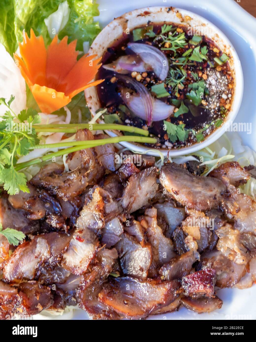 Thai grilled wild boar pork dish Stock Photo - Alamy