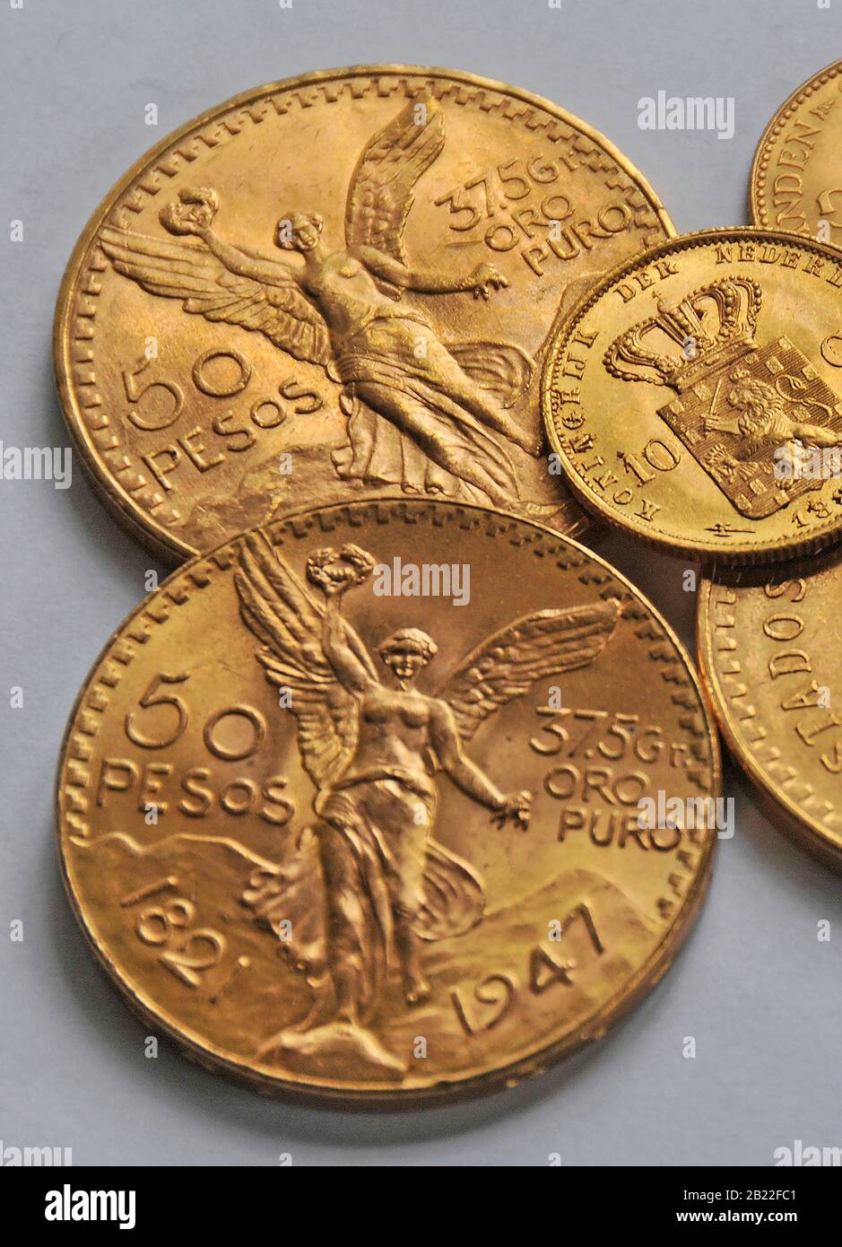 golden coins, 50 pesos mexicans and 10 florins Stock Photo - Alamy