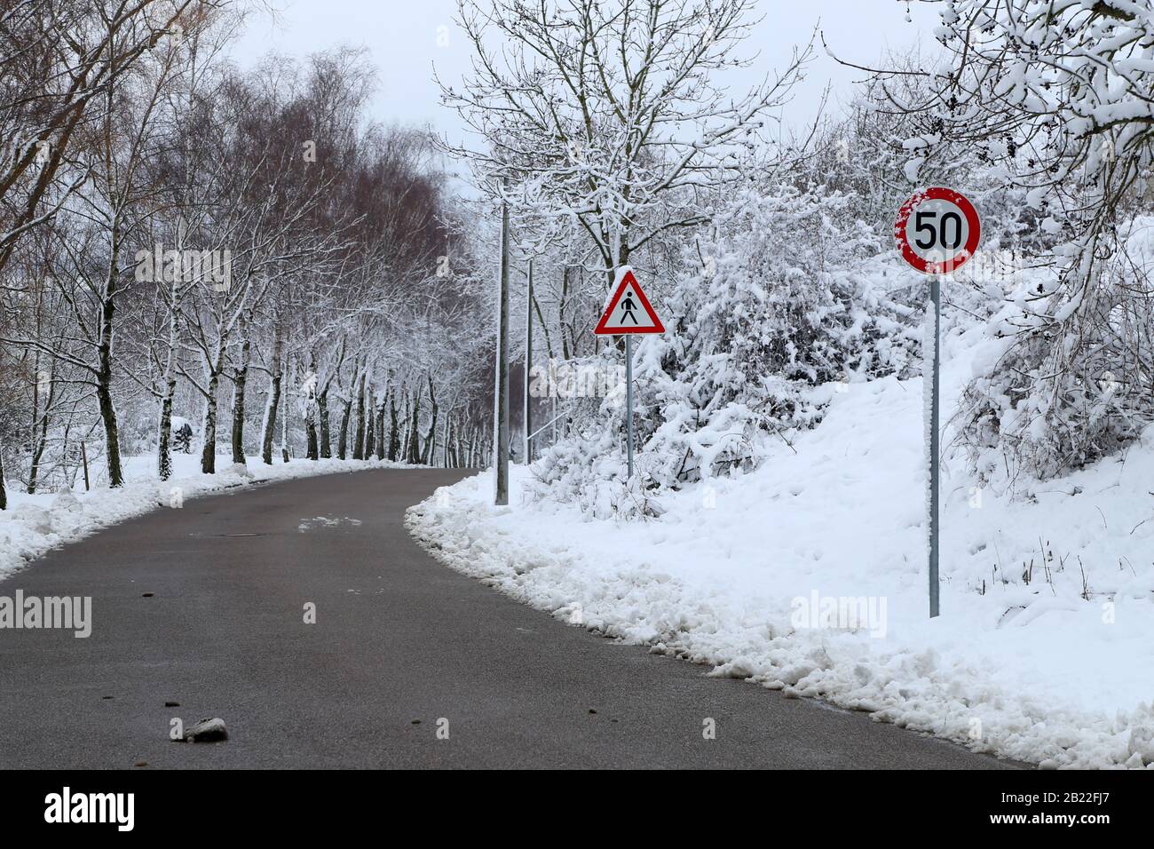 Winter landscape with road and road signs Stock Photo - Alamy