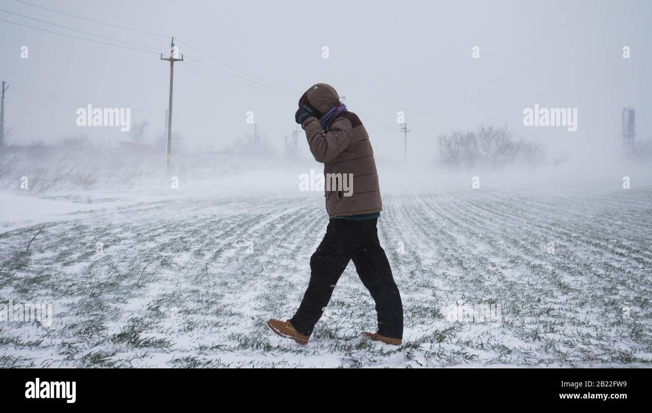 Man walking outside in the cold Stock Photo - Alamy