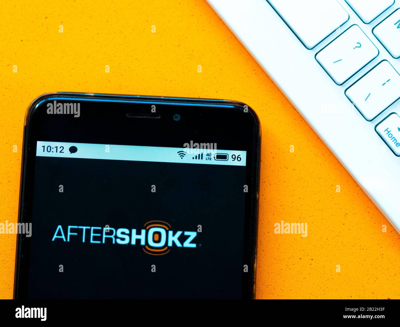 In this photo illustration the Aftershokz logo is seen displayed on a ...