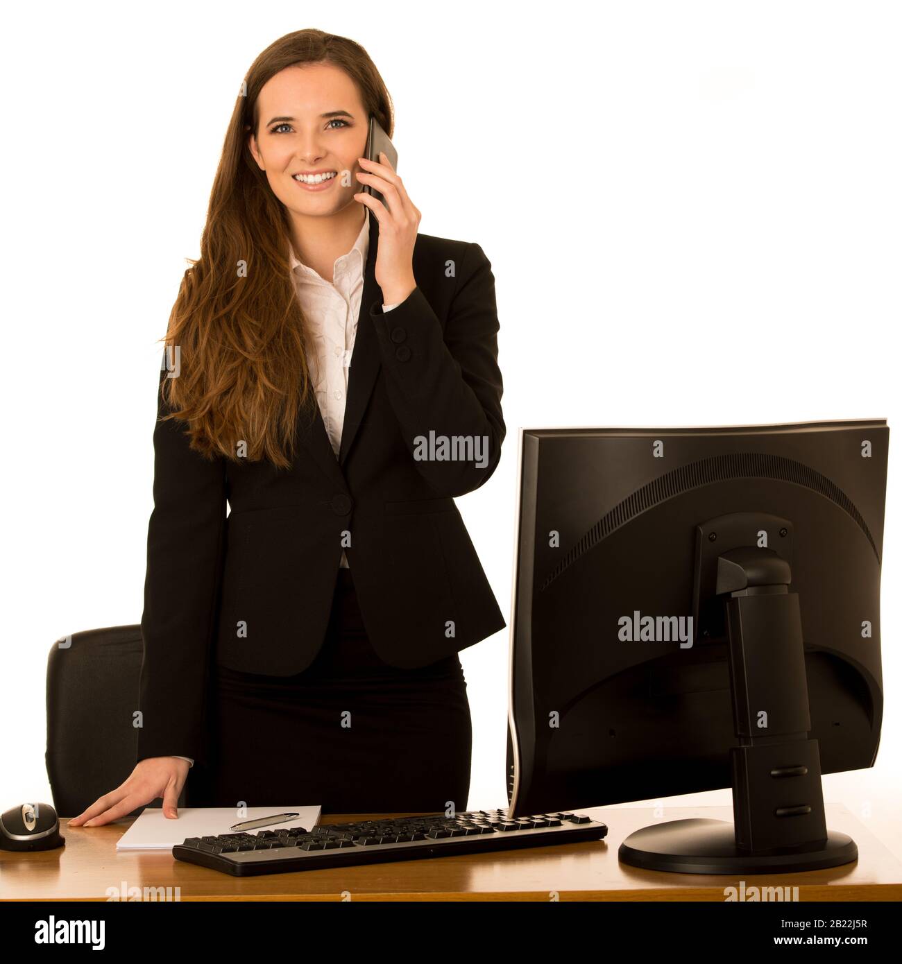 Beautiful young business woman talks on the phone in her office Stock ...