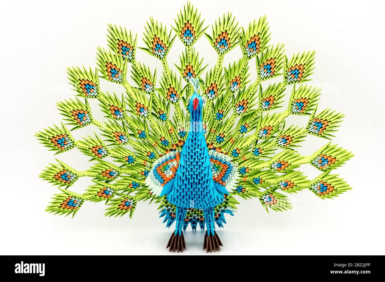 Male paper peacock in front of a white background Stock Photo - Alamy
