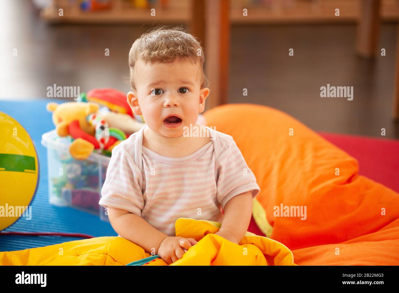 Little baby boy playing in living room on the floor Stock Photo - Alamy