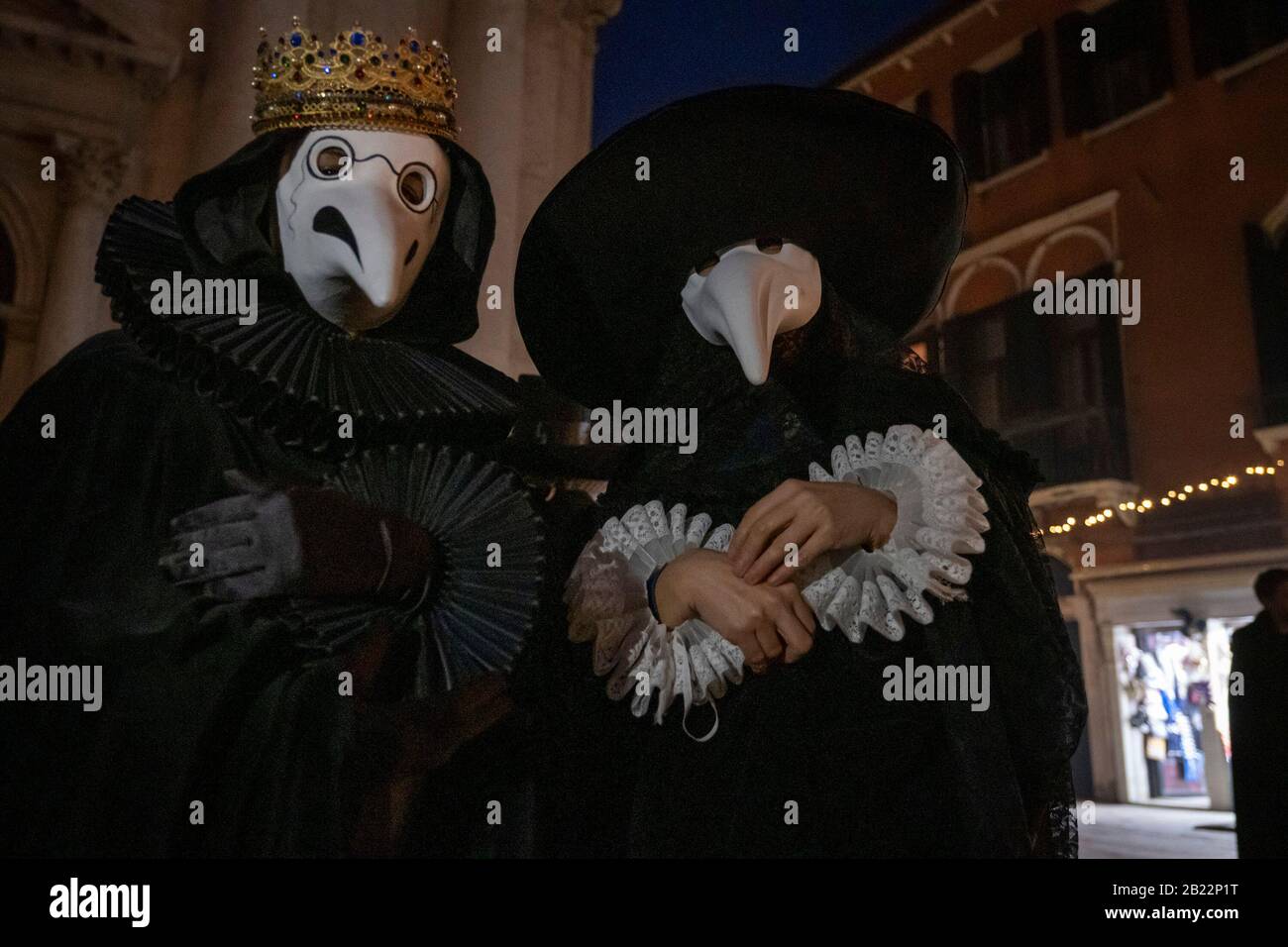 VENICE, ITALY - FEBRUARY 25: Plague doctors pose in Venice on February ...