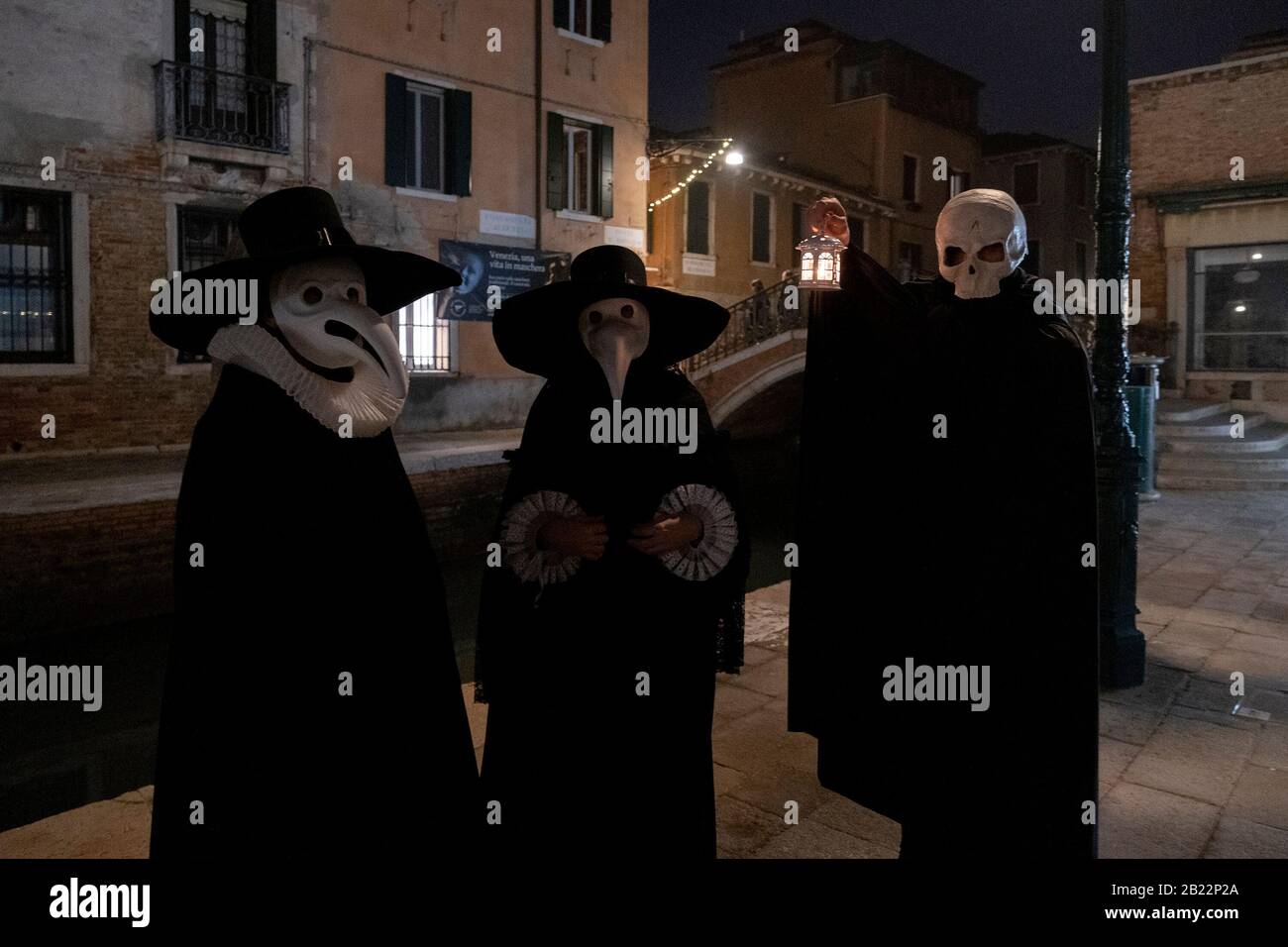 VENICE, ITALY - FEBRUARY 25: Plague doctors pose in Venice on February ...