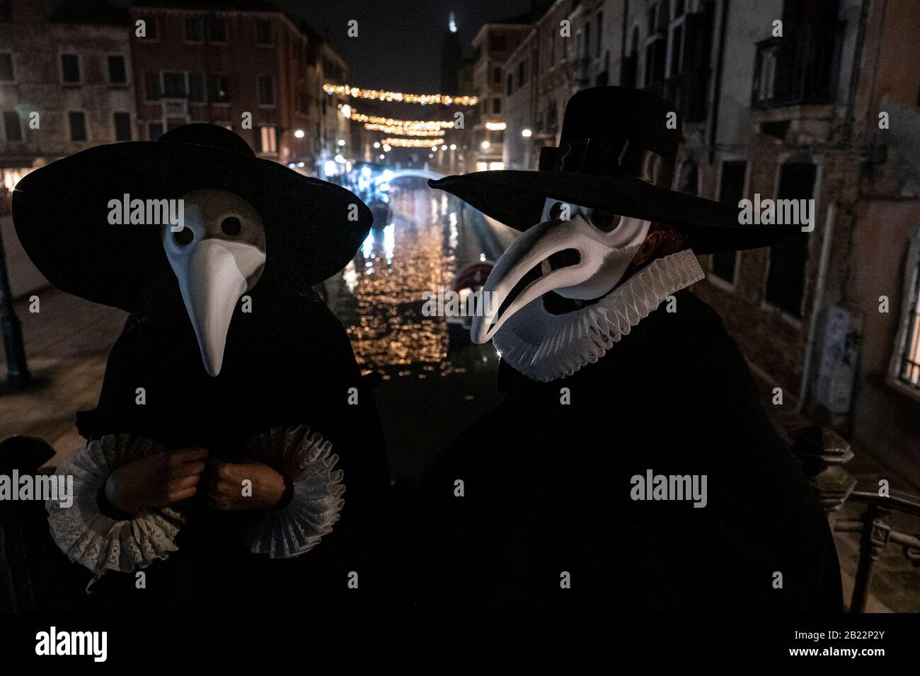 VENICE, ITALY - FEBRUARY 25: Plague doctors pose in Venice on February ...