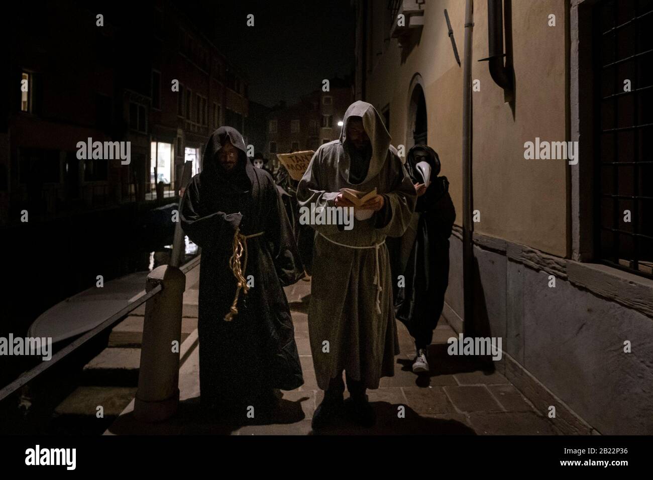 VENICE, ITALY - FEBRUARY 25: Plague doctors pose in Venice on February ...