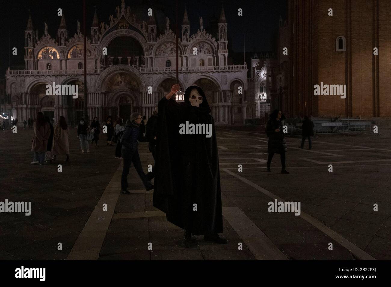 VENICE, ITALY - FEBRUARY 25: Plague doctors pose in Venice on February ...