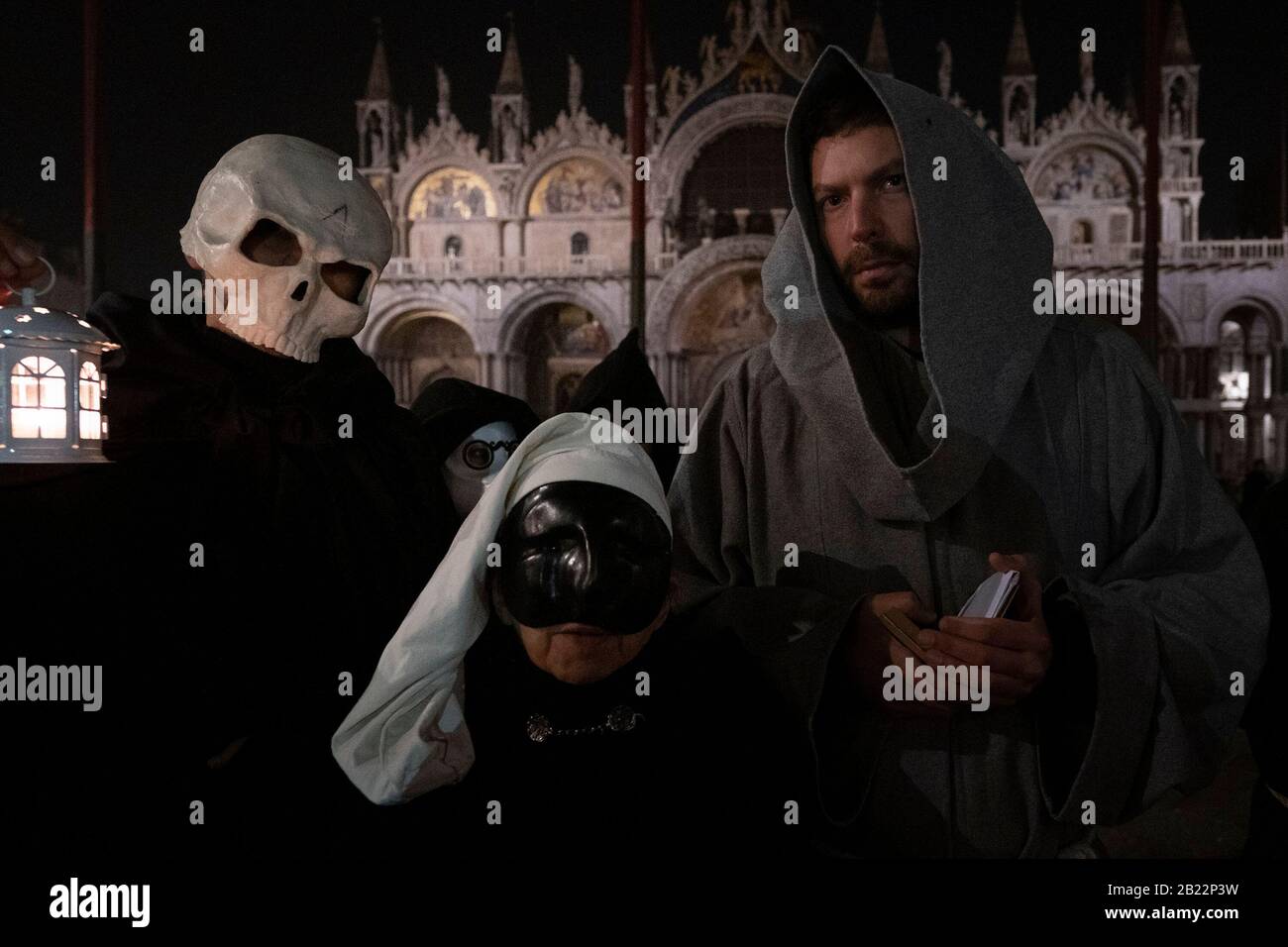 VENICE, ITALY - FEBRUARY 25: Plague doctors pose in Venice on February ...