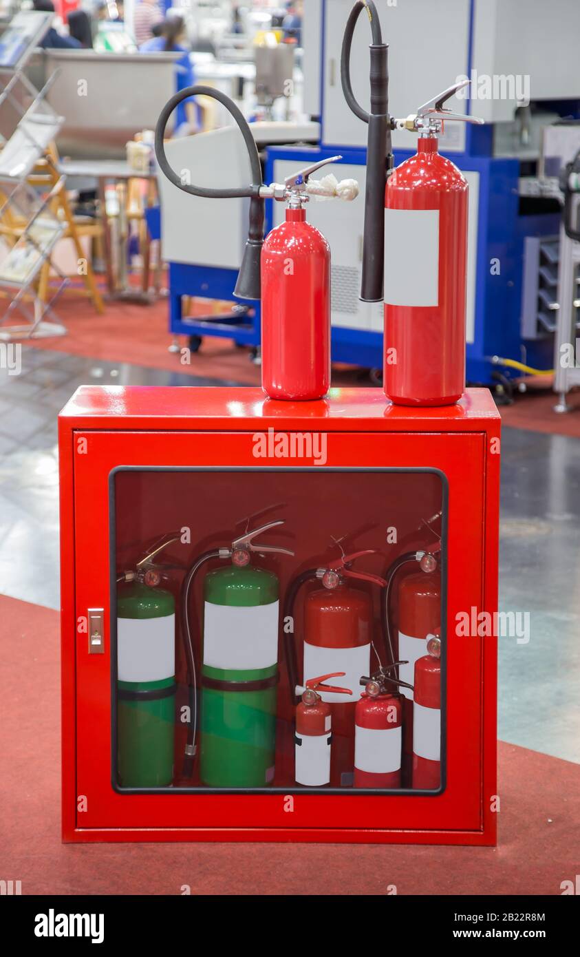 Wall mounted fire extinguisher set in cabinet Stock Photo - Alamy
