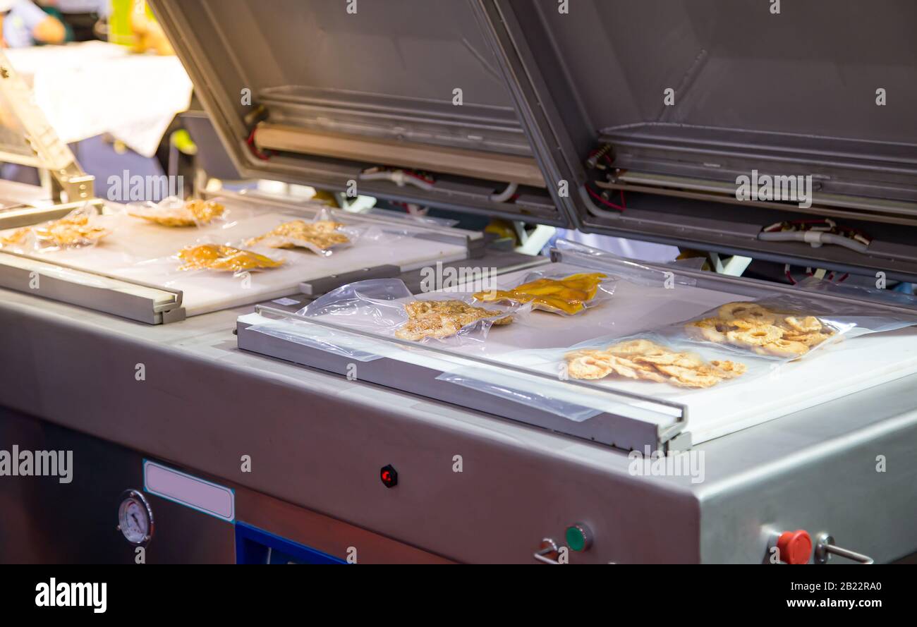 Heat sealing vacuum machine for food packaging Stock Photo - Alamy