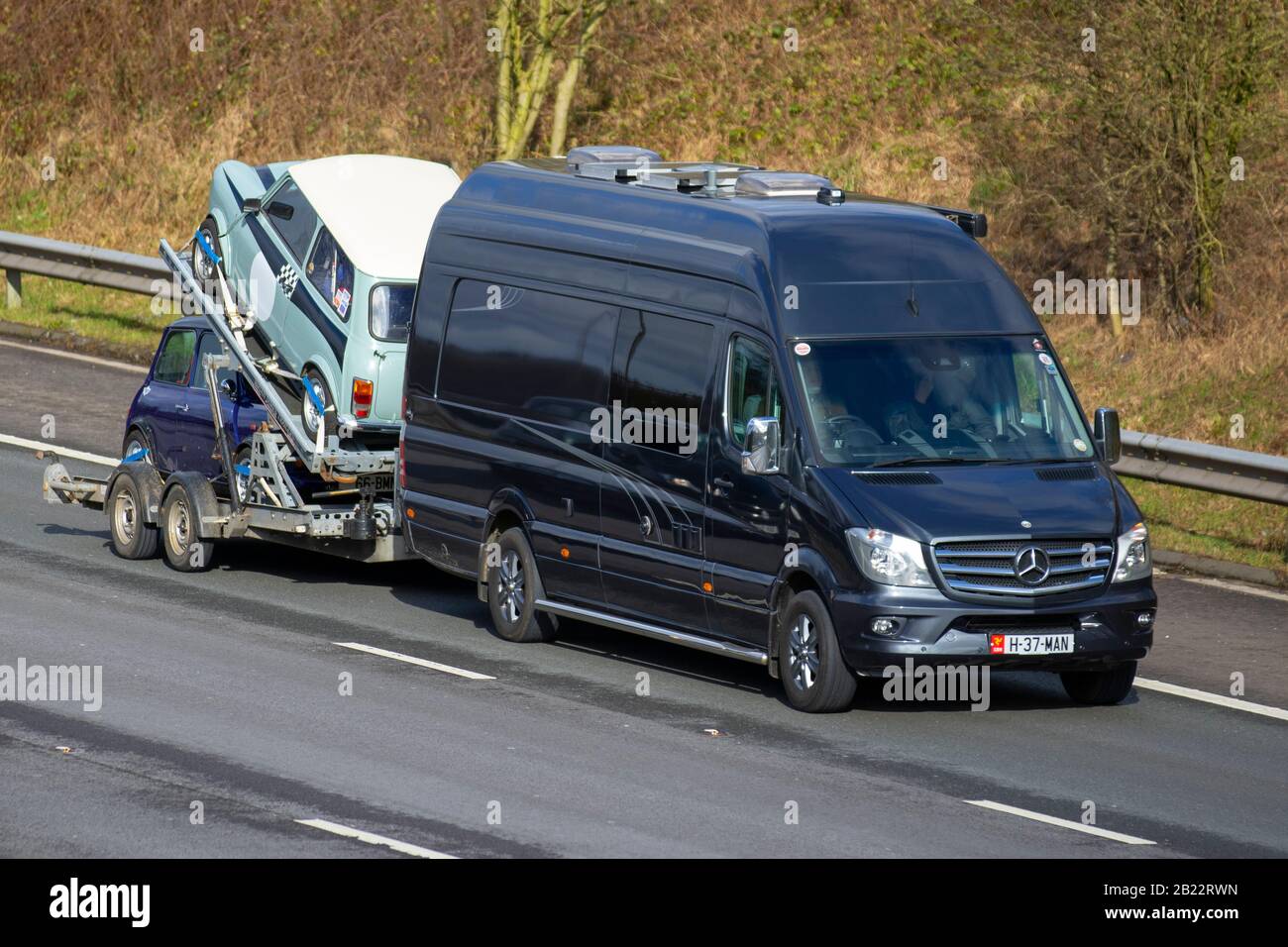 Two British BMC minis on car trailer; Vehicular traffic, transport ...