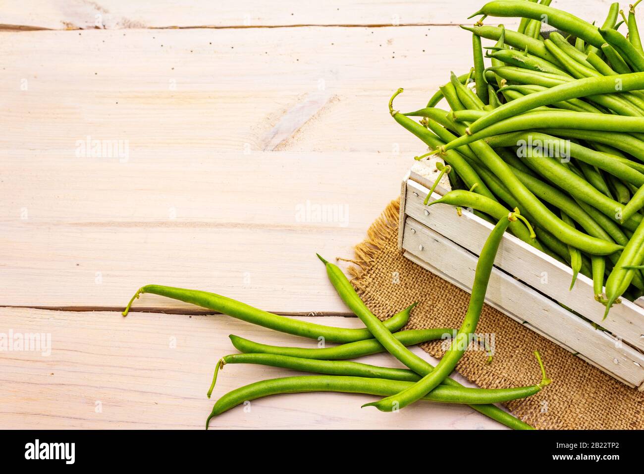Phaseolus vulgaris, green common bean or kidney bean in wooden box ...