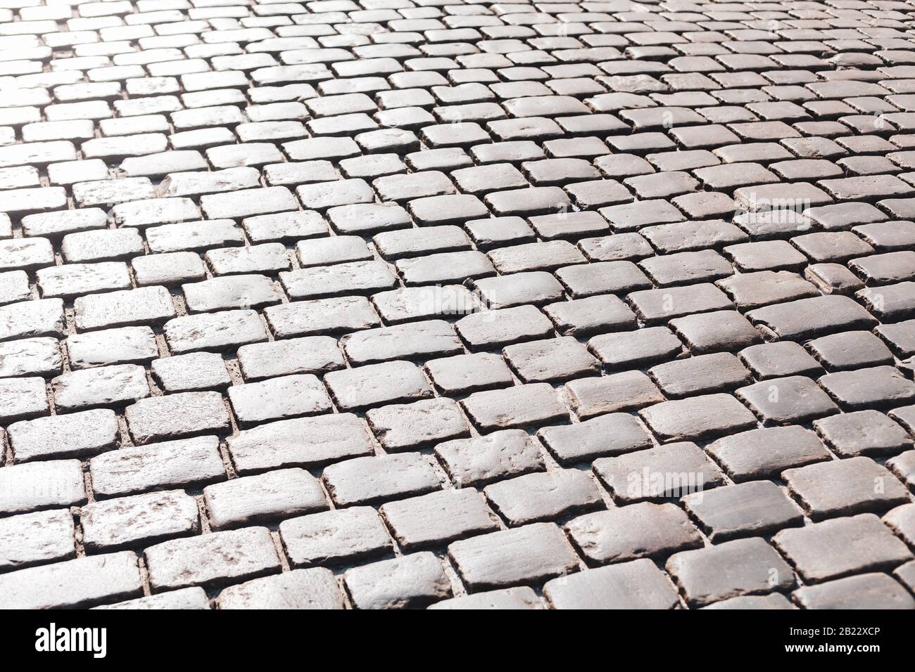 Simple grey convex square stone pavement surface, paving, causeway ...