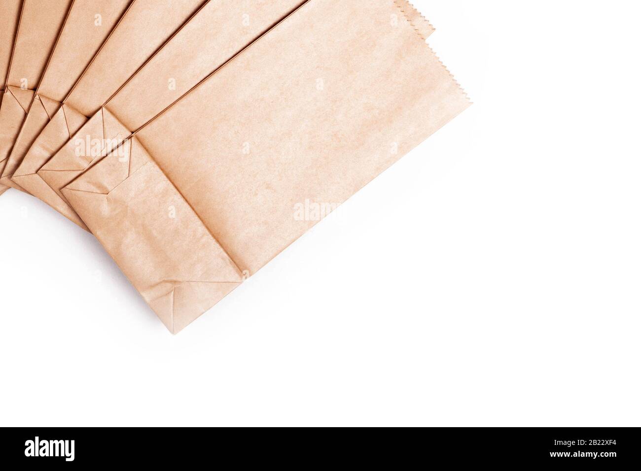 A few simple small tiny eco friendly new disposable brown paper bags ...