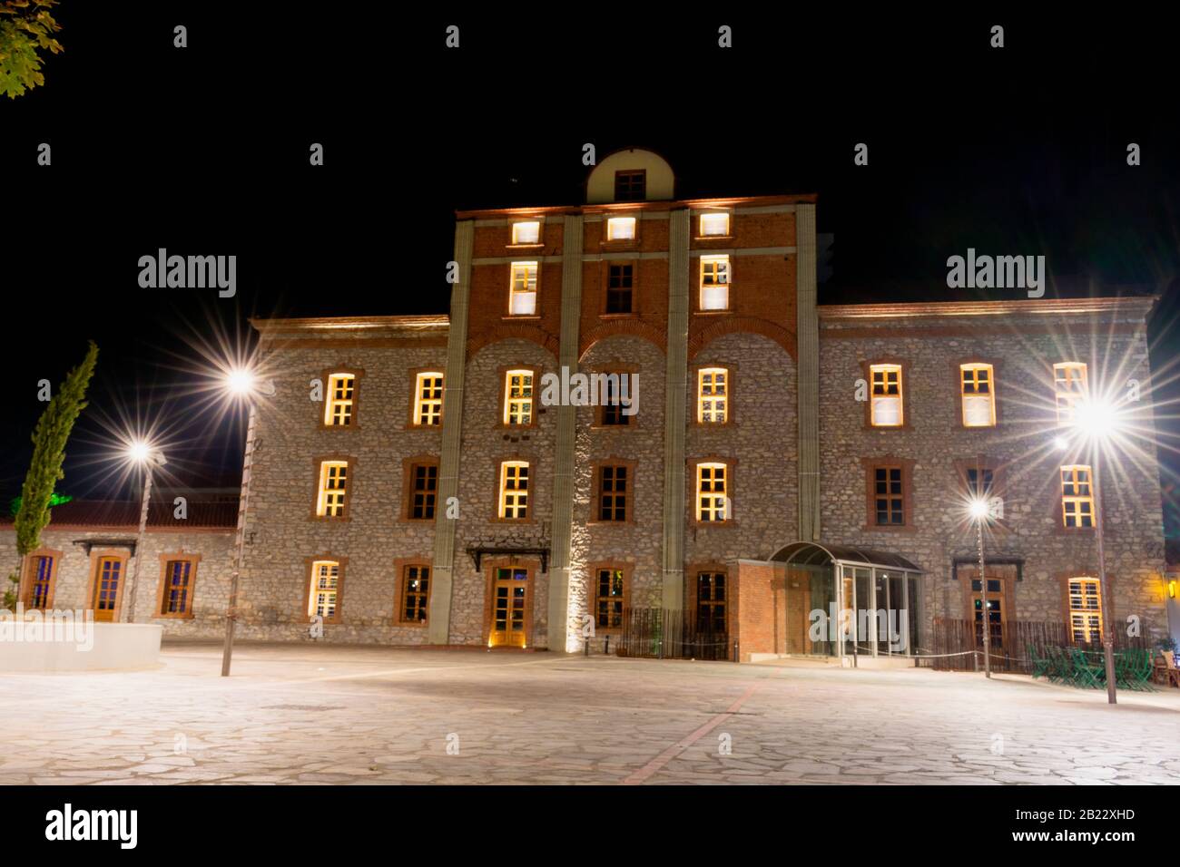 Night photo of an old stone building illuminated Stock Photo - Alamy