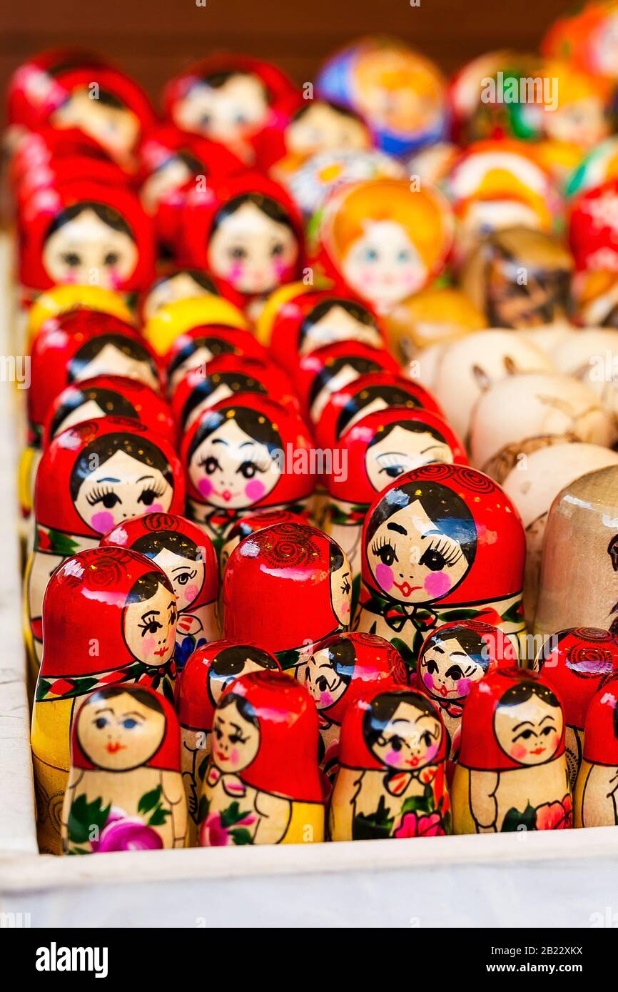 Lots of traditional national russian red matryoshka toy dolls, market ...