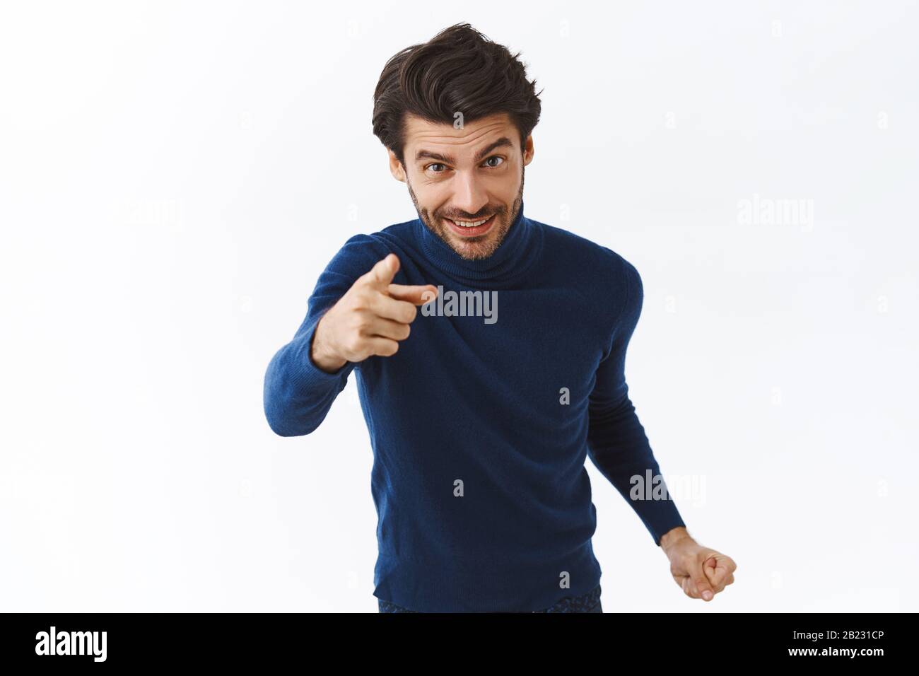 Guy making choice, picking. Handsome bearded stylish man in high neck ...