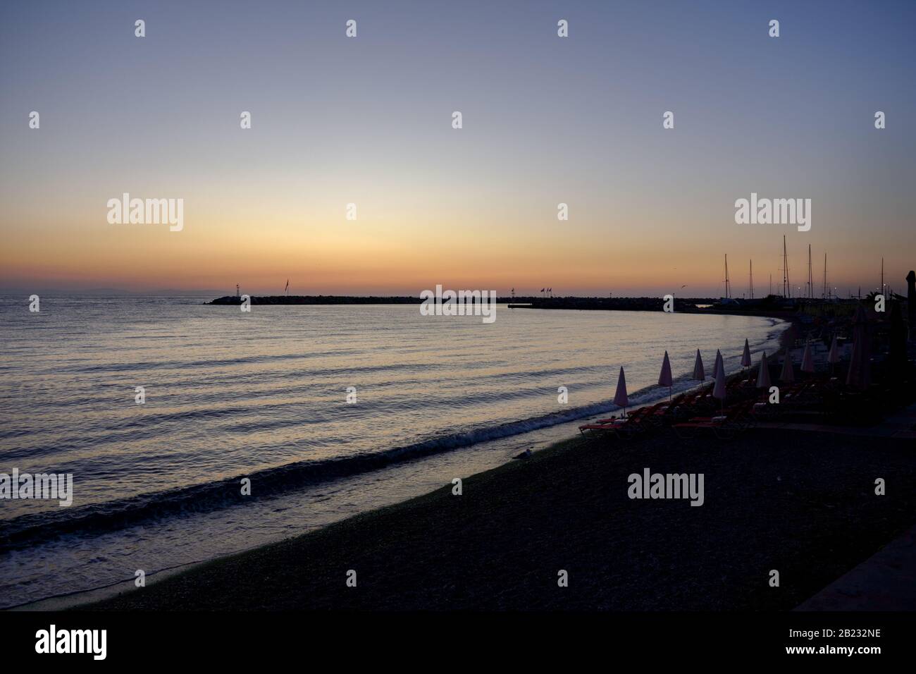 Sunset against the backdrop of Platamonas port and beach in Macedonia ...