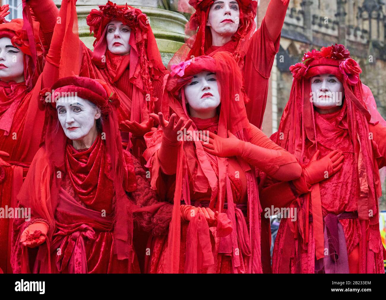 The Red Rebels Brigade of Extinction Rebellion displaying their ...