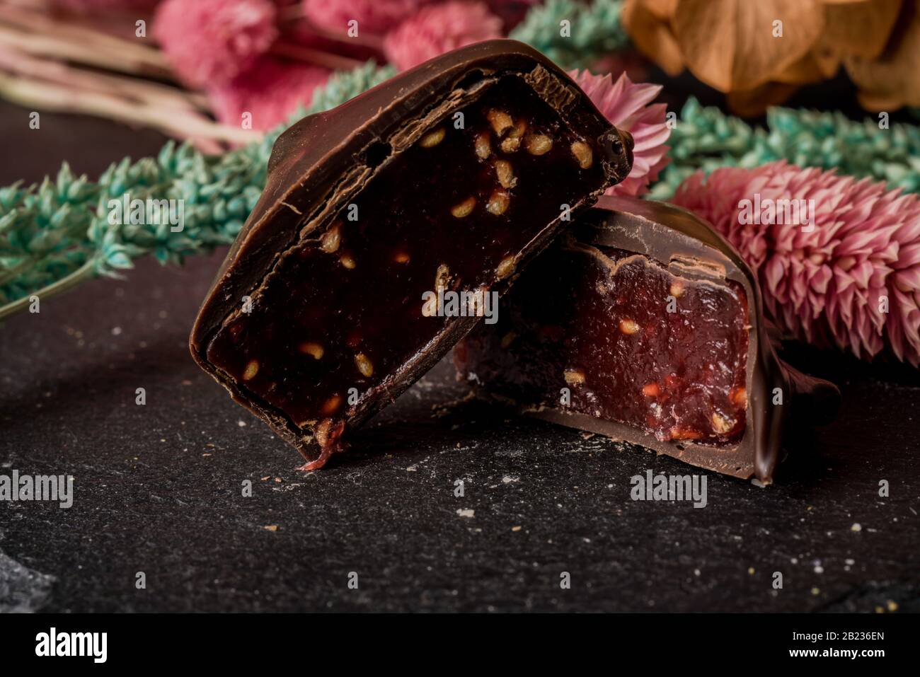 Homemade dried dewberry Belgian chocolates on dark background Stock ...
