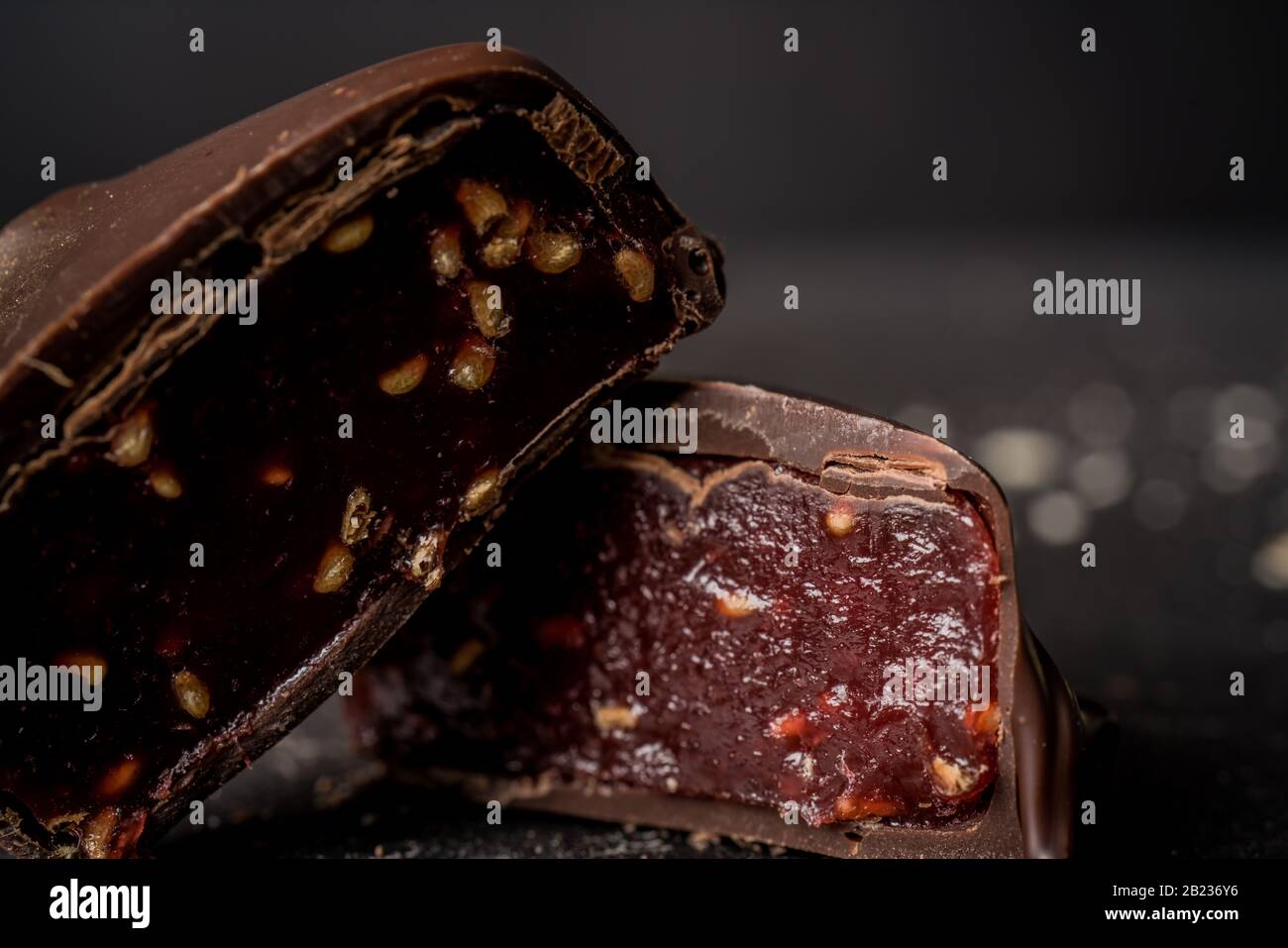 Homemade dried dewberry Belgian chocolates on dark background Stock ...