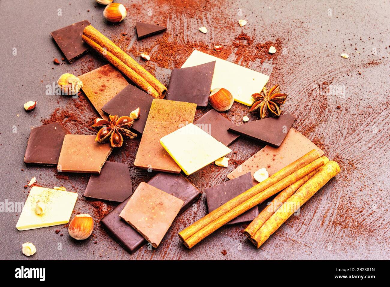 Assorted broken chocolate with different cocoa content, spices ...
