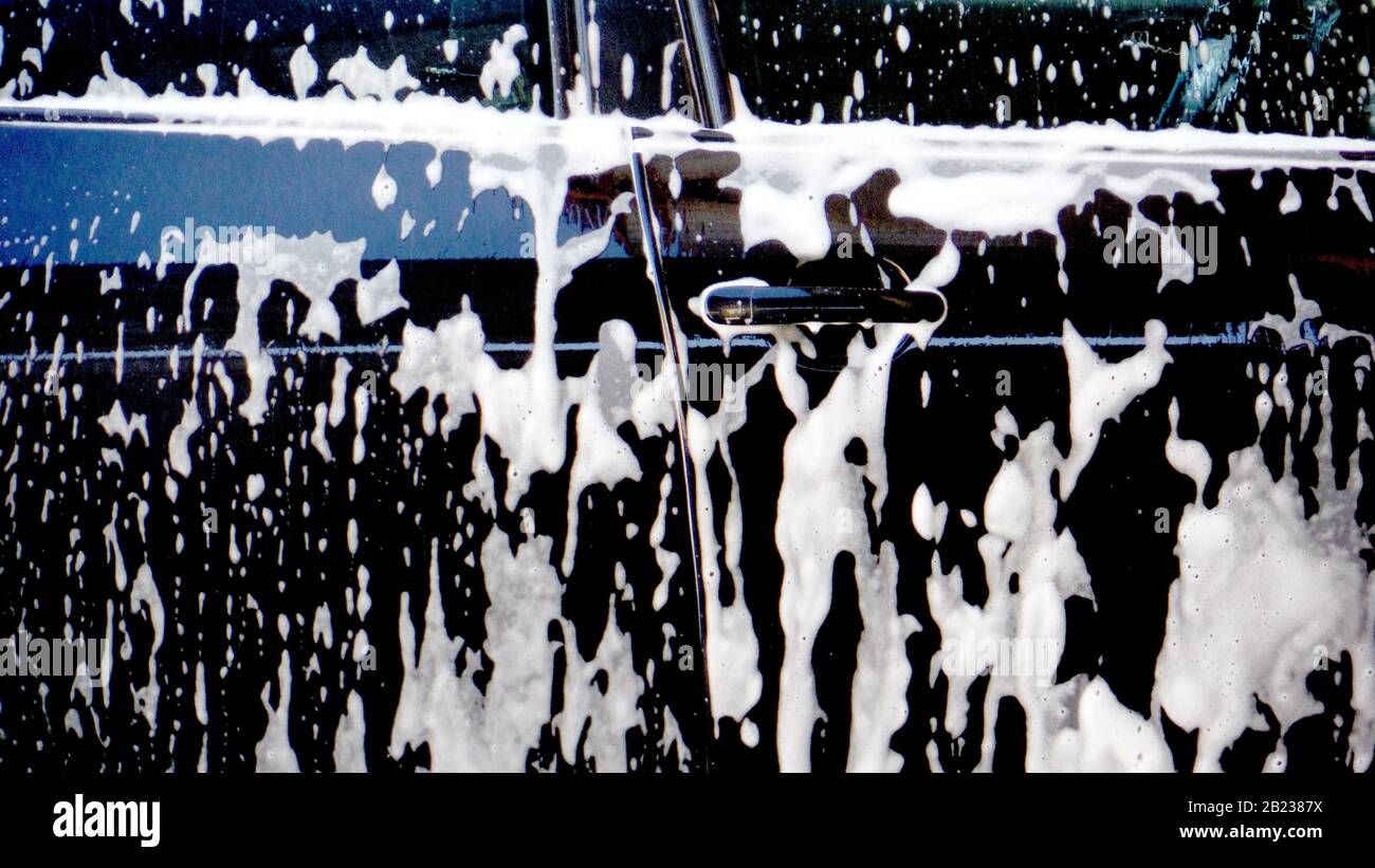 foam on a car surface during washing image Stock Photo - Alamy