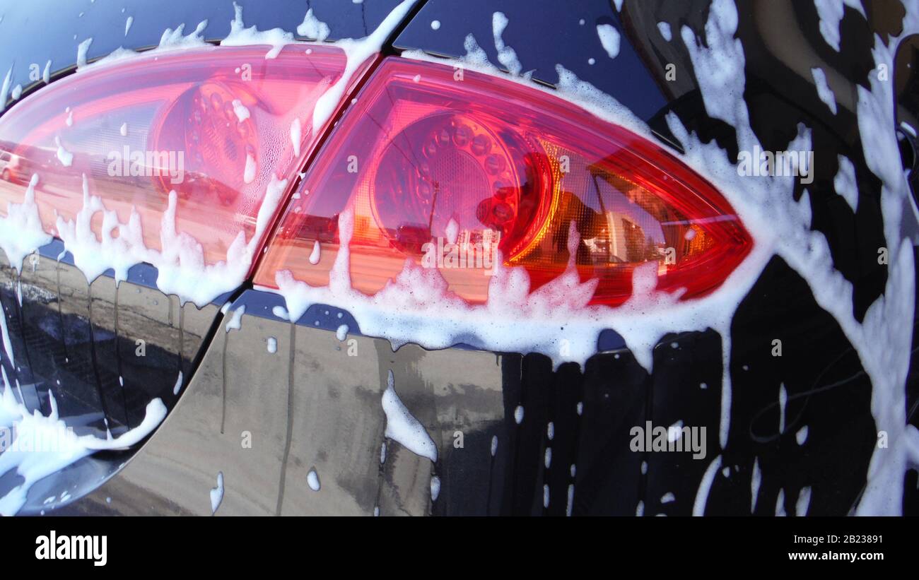 foam on a car surface during washing image Stock Photo - Alamy