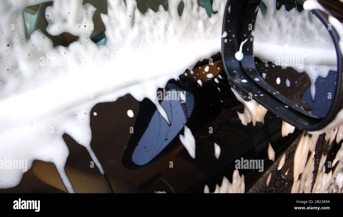 foam on a car surface during washing image Stock Photo - Alamy