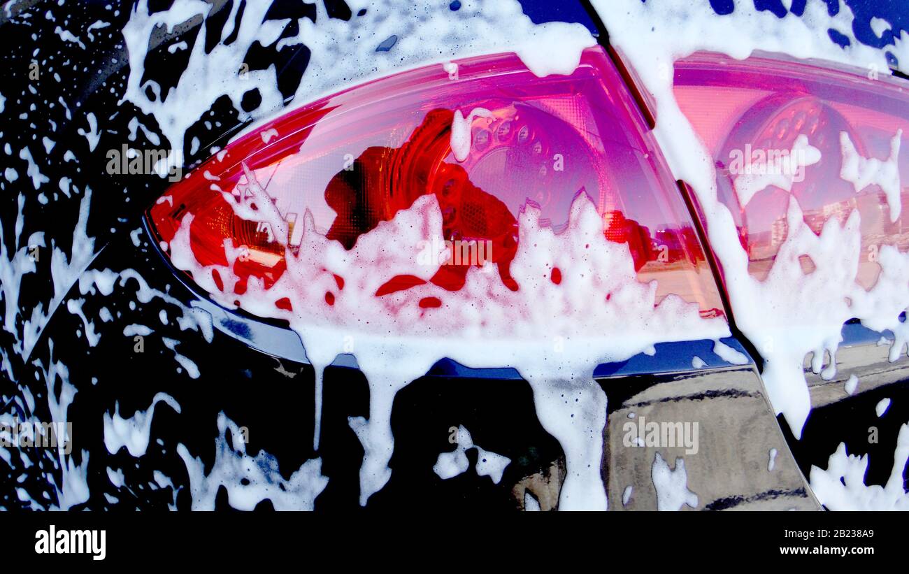 foam on a car surface during washing image Stock Photo - Alamy