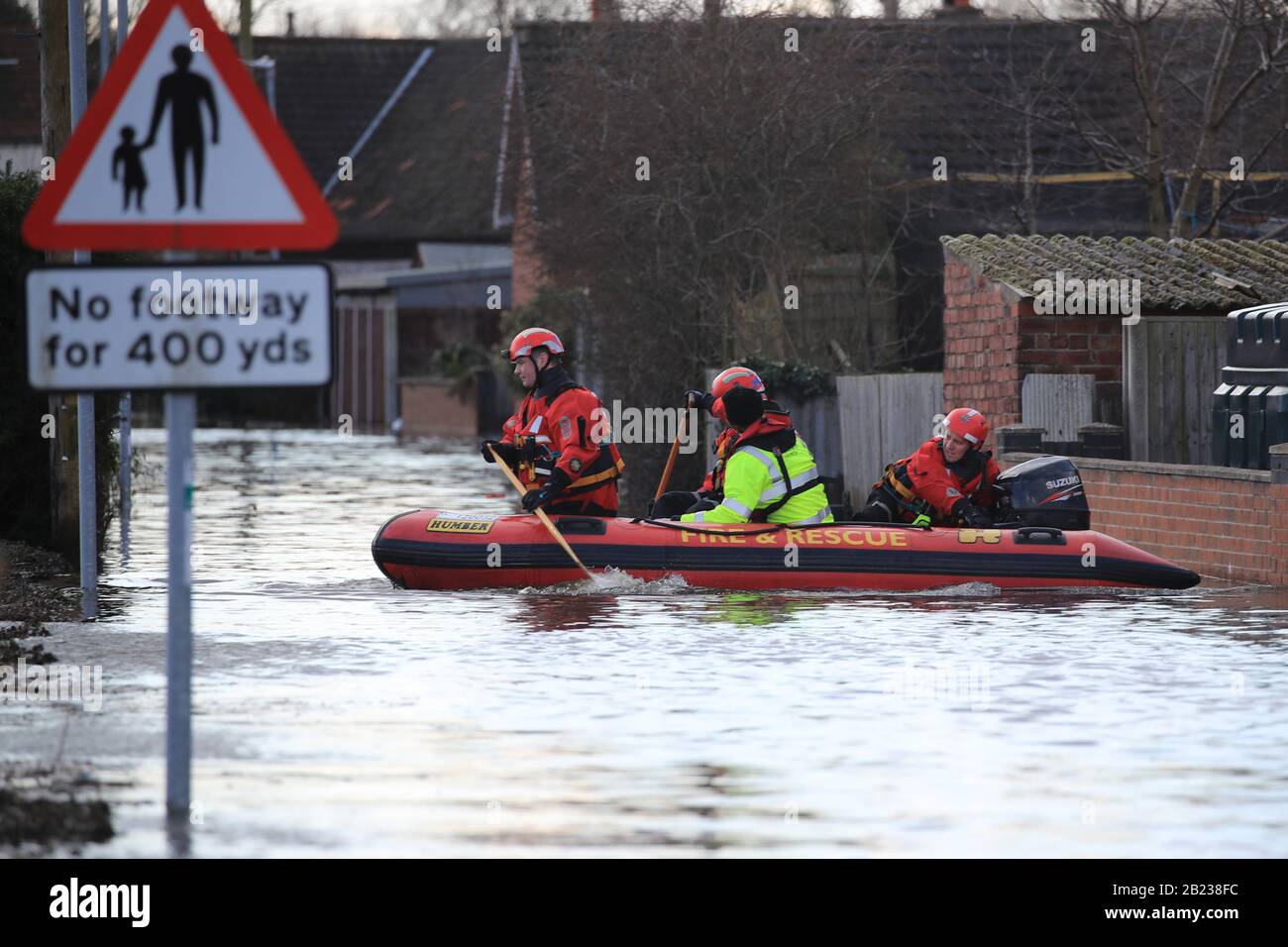 Rescue workers in the flooded village of East Cowick, Yorkshire, after ...
