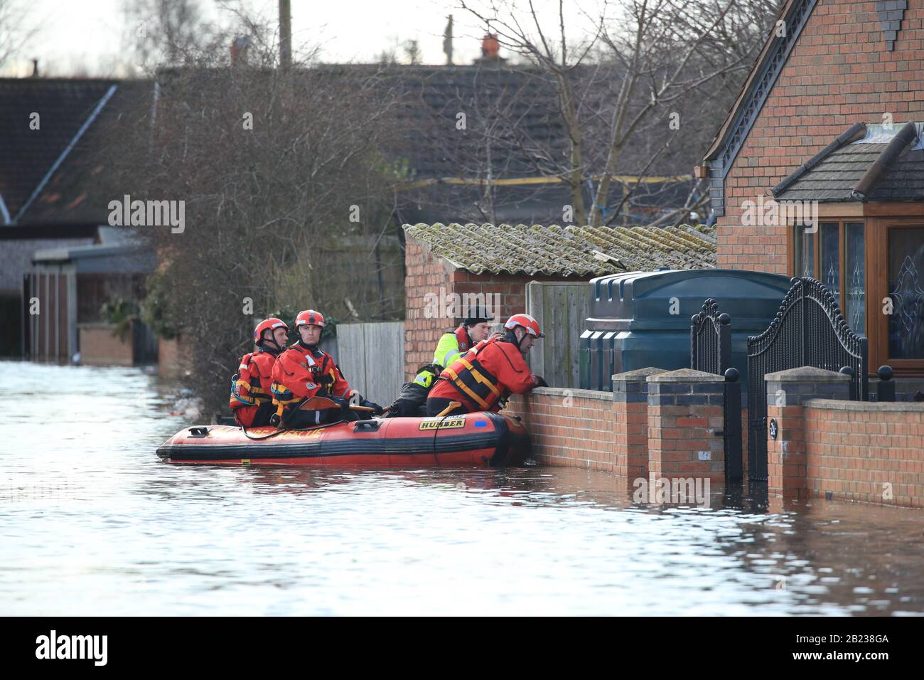 Rescue workers in the flooded village of East Cowick, Yorkshire, after ...