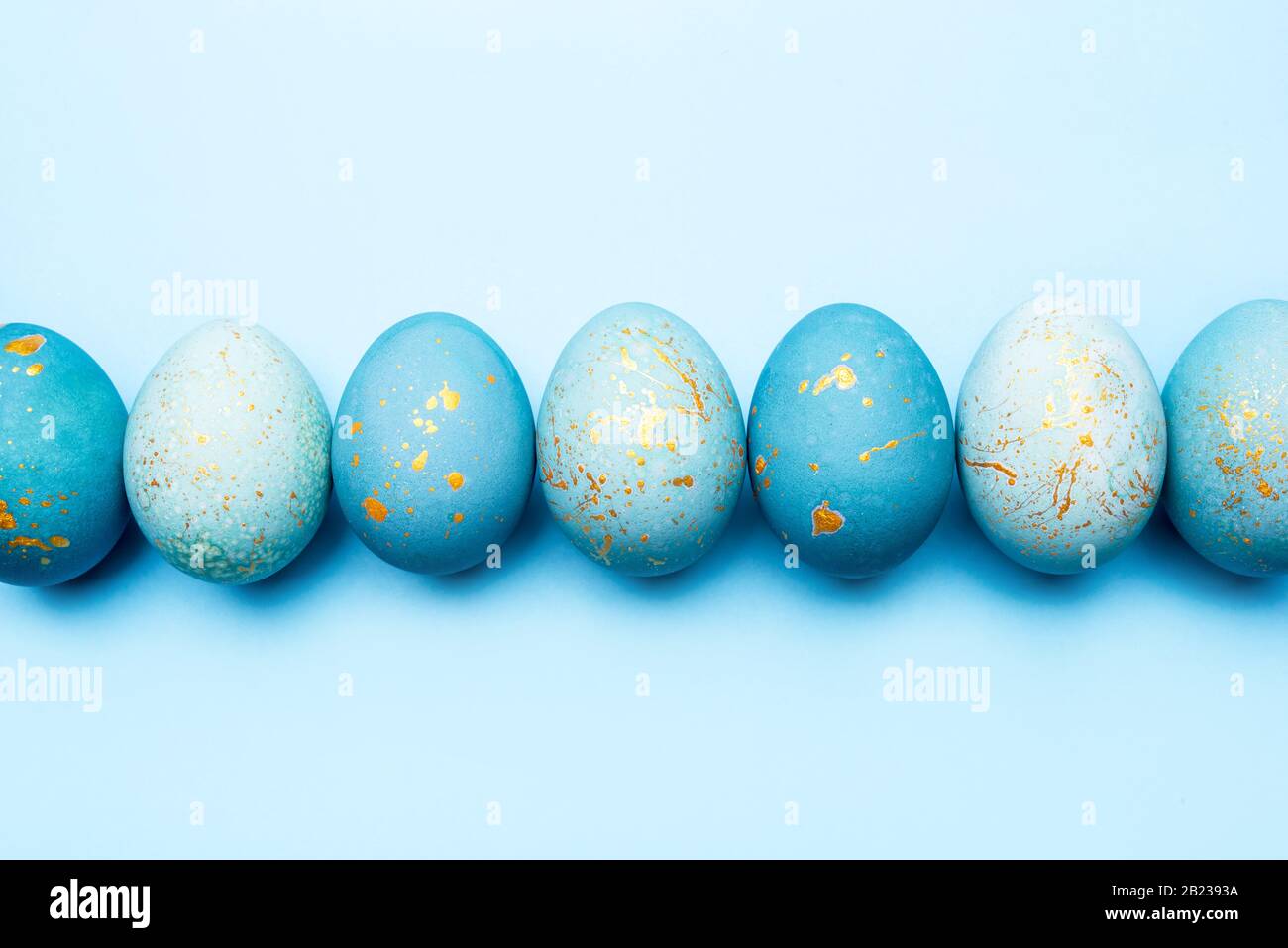 Easter background of eggs painted in blue color Stock Photo - Alamy