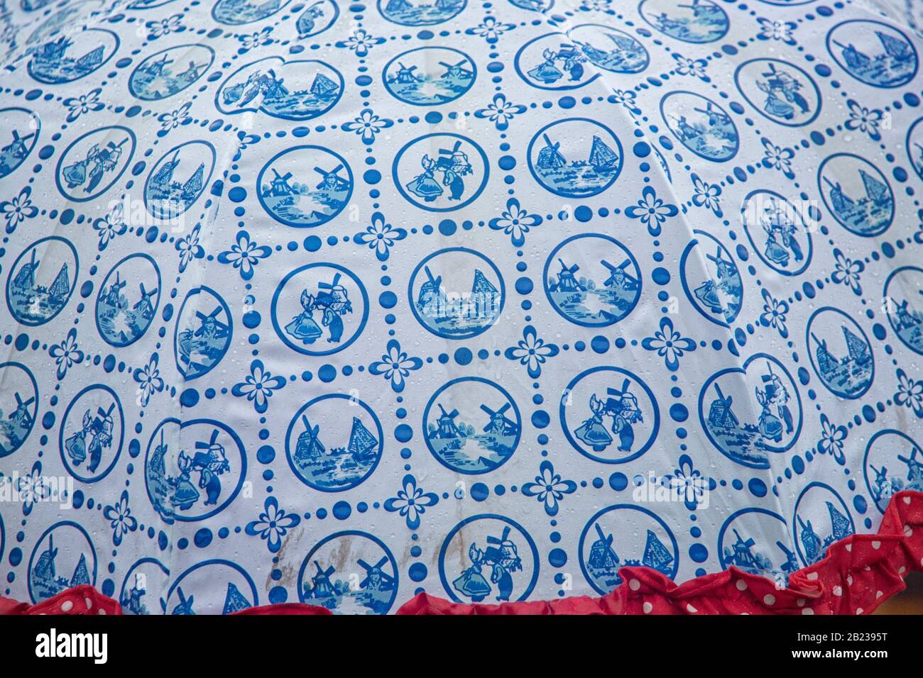 Dutch umbrella with rain and windmills in delft blue Stock Photo - Alamy