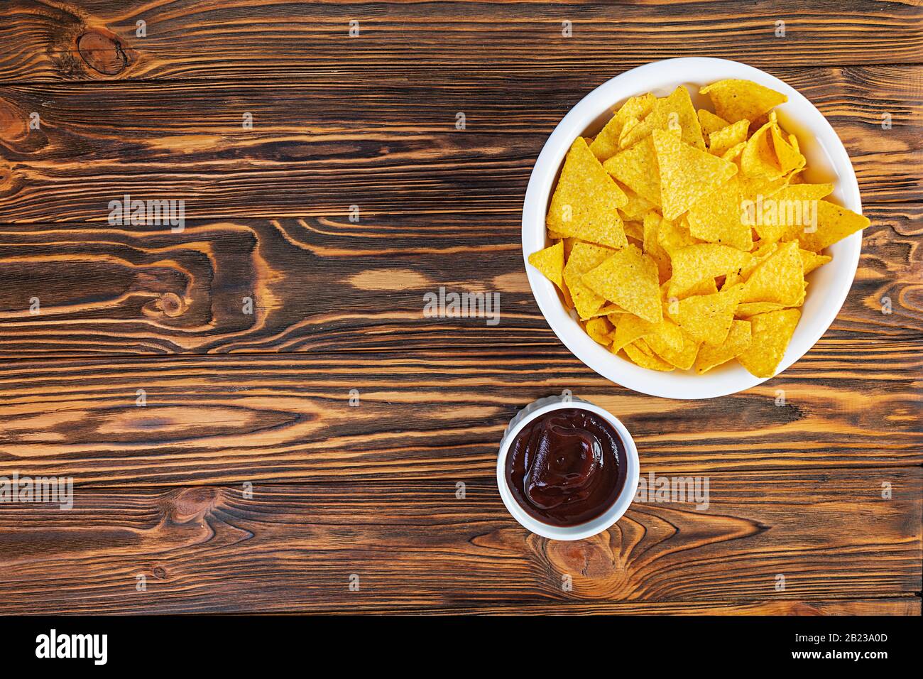 Mexican nachos with cheese. Corn chips with guacamole, salsa and tomato ...
