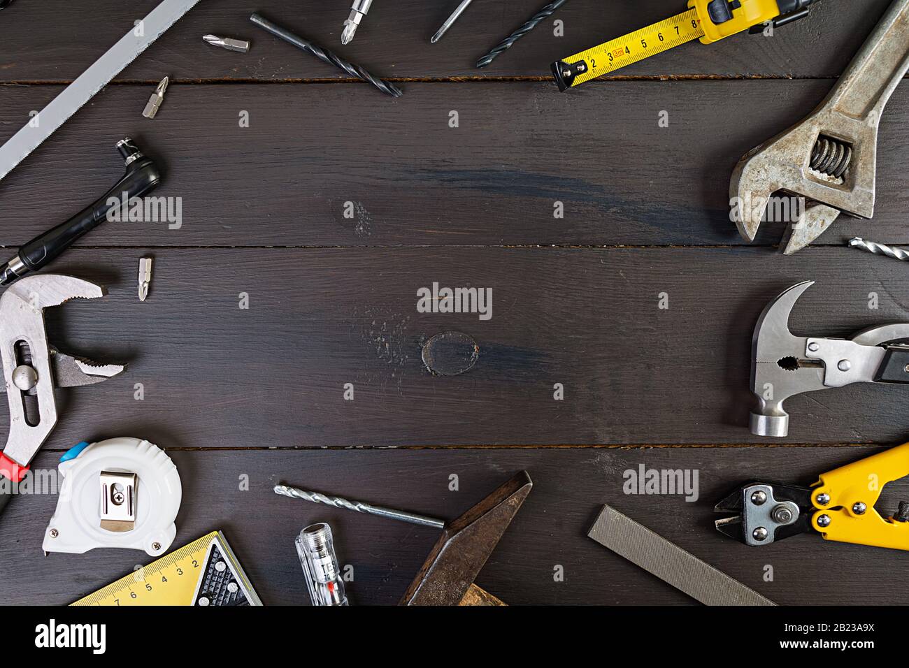 Set of working tools on wooden rustic background. Top view. Copy space ...