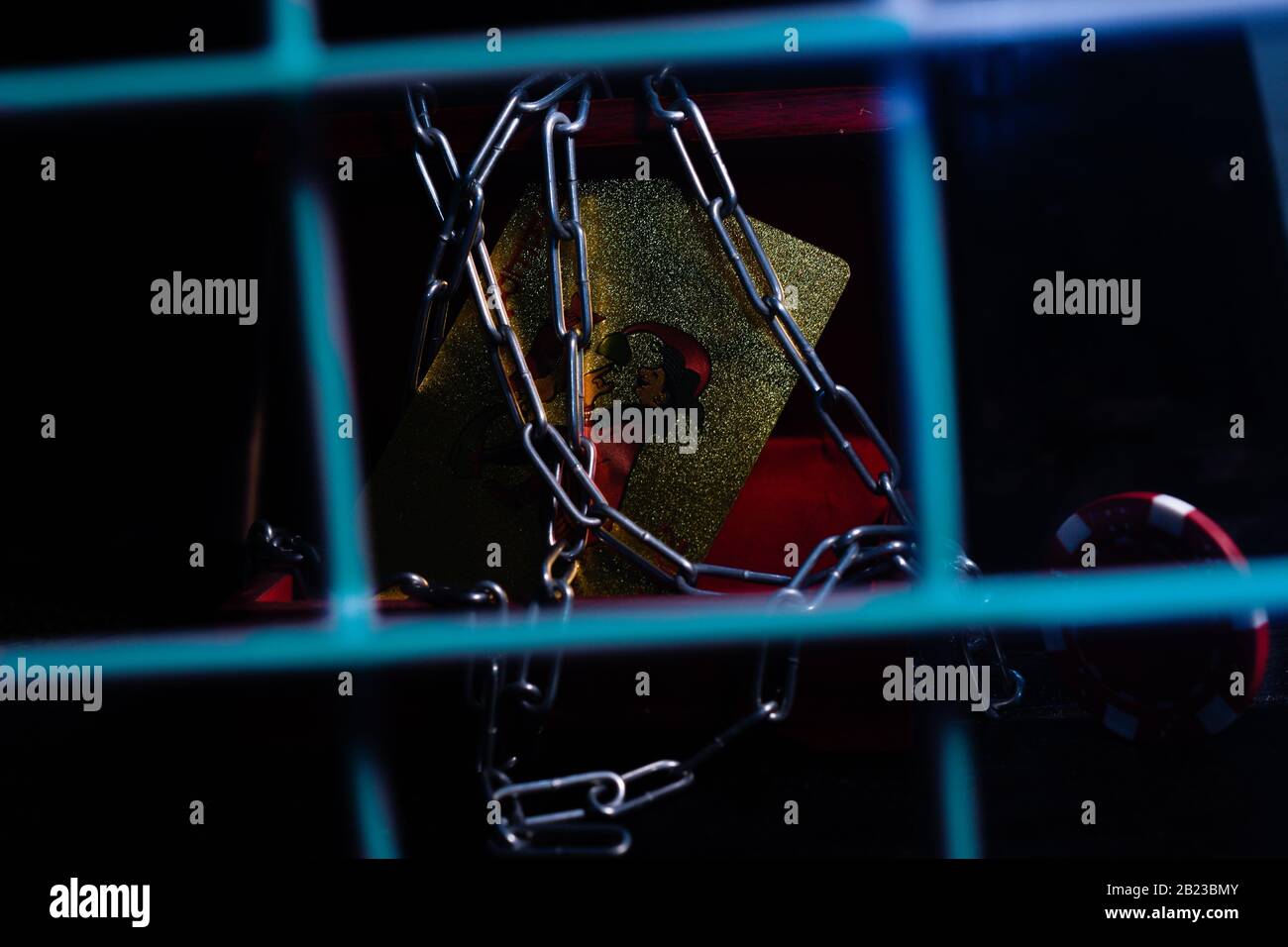 joker card and a box was locked by chain Stock Photo - Alamy