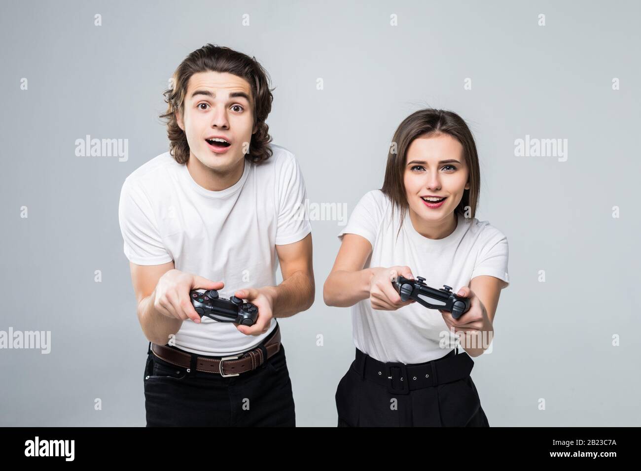 Photo of caucasian couple man and woman playing together video games ...