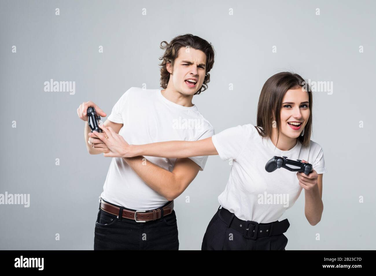 Full length portrait of a young attractive couple standing isolated ...