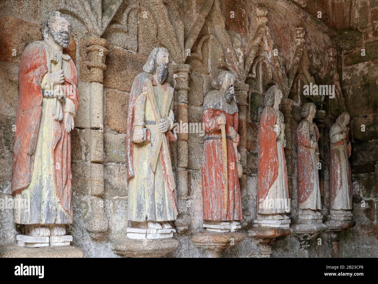 Medieval wooden statues of saints - apostles - at the entrance to the ...