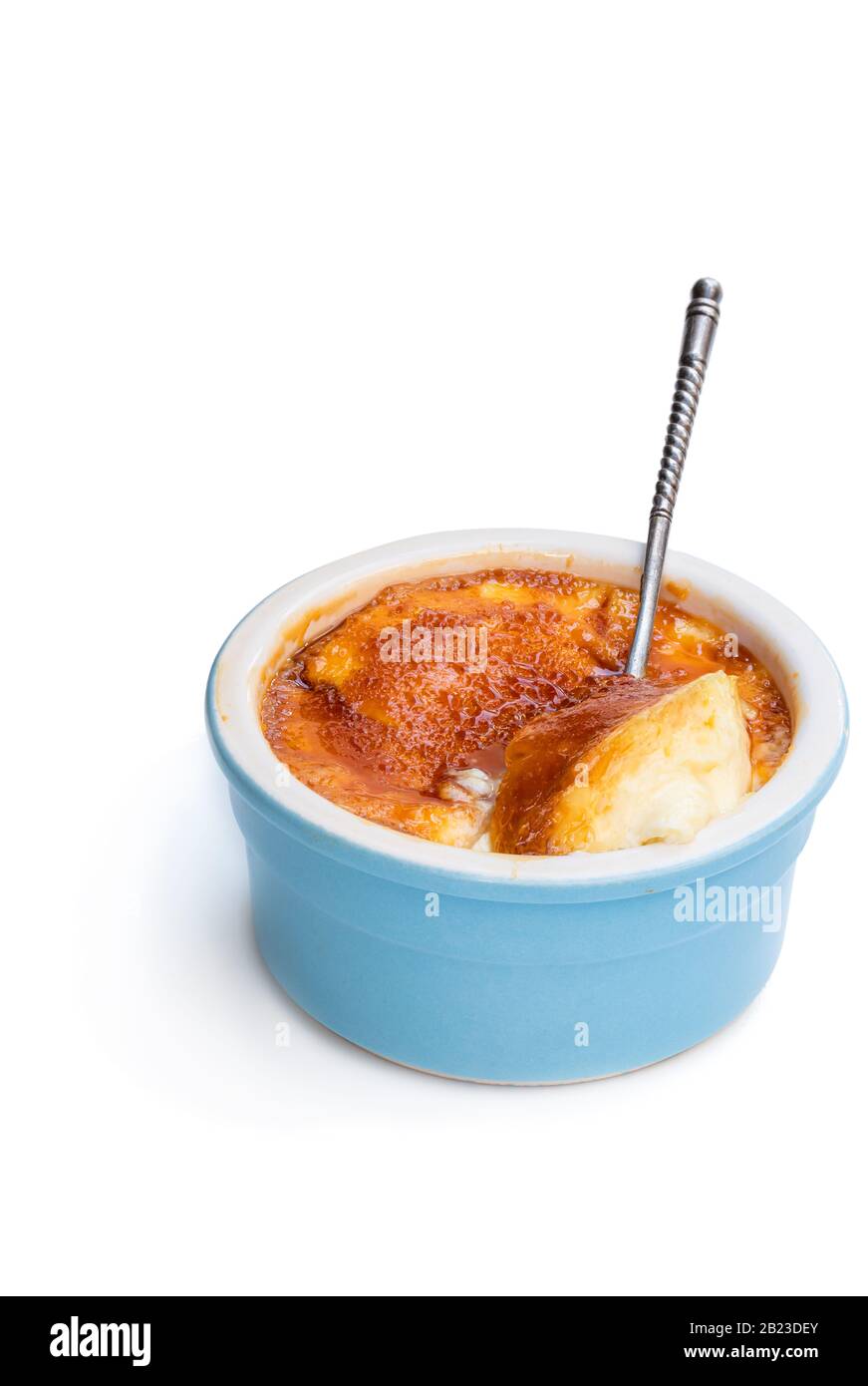 Creme brulee in blue porcelain pot isolated on white Stock Photo - Alamy