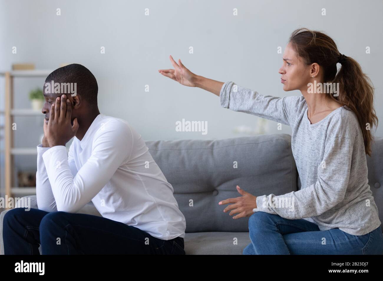 Angry girlfriend blaming African American boyfriend, relationship ...