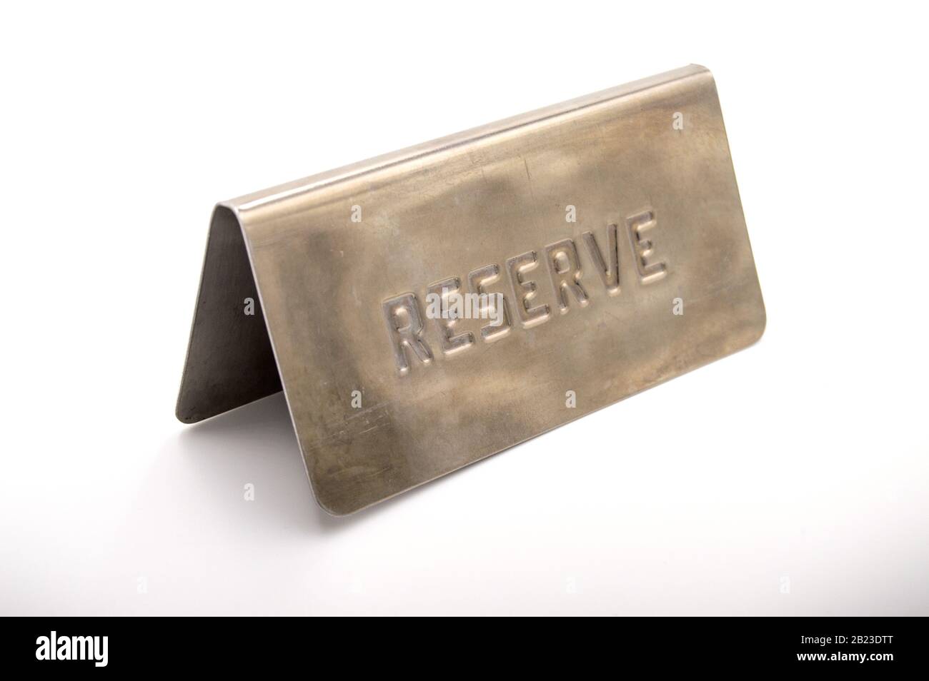 Plate of reservation of table of aluminum restaurant on white bottom ...